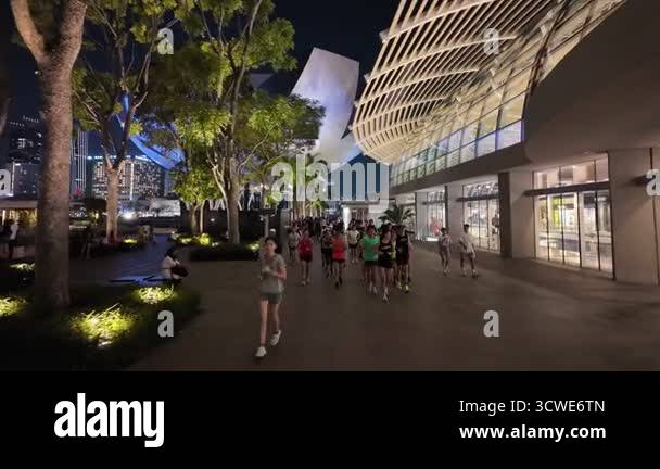 Marina Sand, Singapore - Jul 17 2024: People run at the open space ...