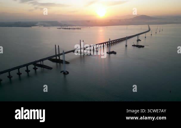 Gelugor, Penang, Malaysia - Jun 11 2024: Penang Bridge with a sunrise ...