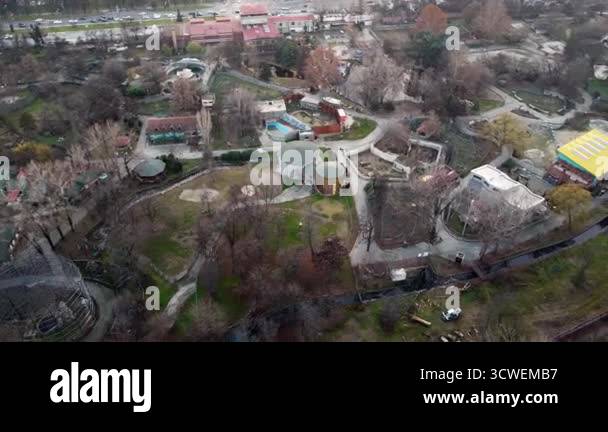 Aerial view of empty zoo grounds in winter. Animal enclosures, walkways ...