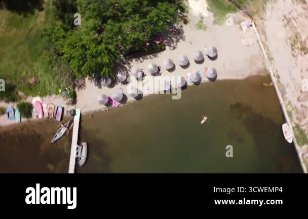 Rotating aerial footage from Lake Dojran in North Macedonia. People ...