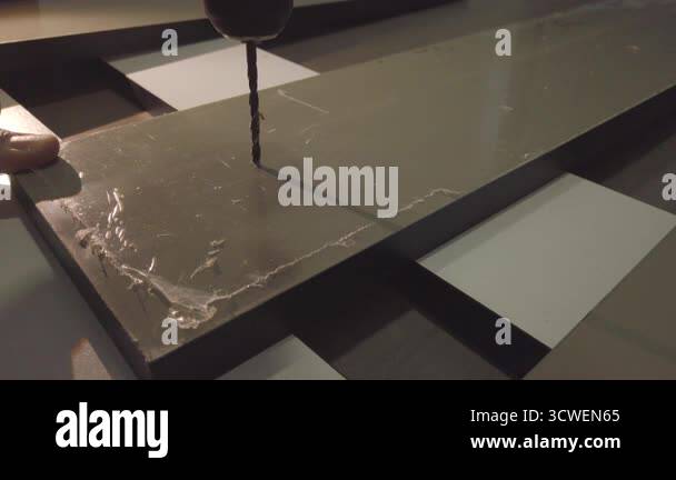 Hand drill making hole in an mdf board. DIY home project Stock Video ...