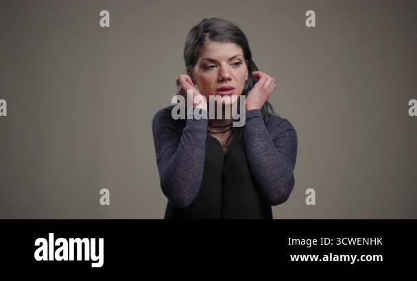 A vivid portrayal of a woman, expressing deep emotional distress with ...