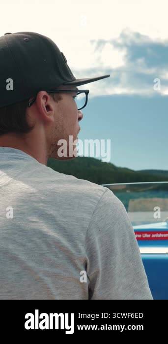 Man driving electric boat ship, turning wheel, back view. Male sailing ...