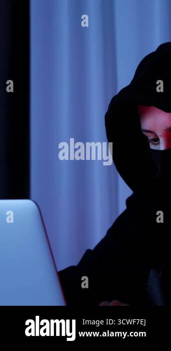 Female face looking at laptop screen, typing on keyboard and coding ...