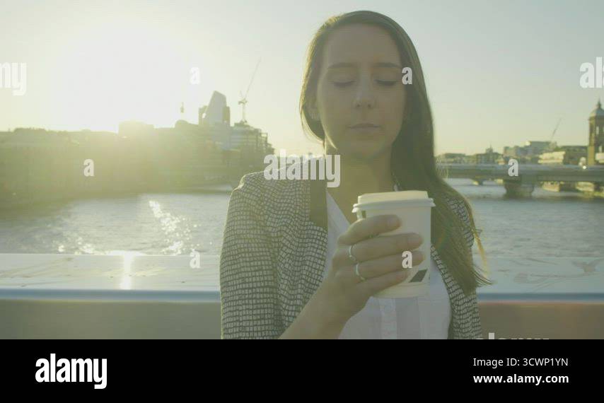 Attractive business woman commuter drinking coffee Stock Video Footage ...