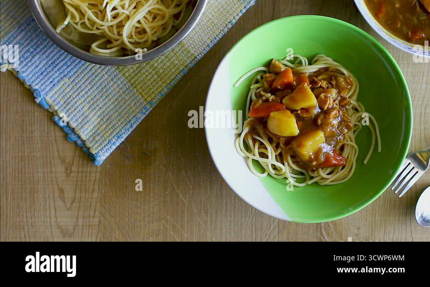 spaghetti with a japanese curry Stock Video Footage - Alamy