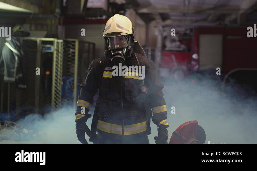 firefighter portrait wearing full equipment, oxygen mask, and power ...