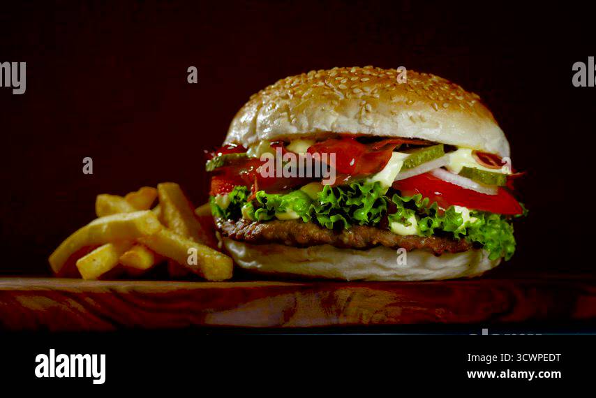 bacon hamburger with french fries. Bun with beef meat, lettuce, tomato ...