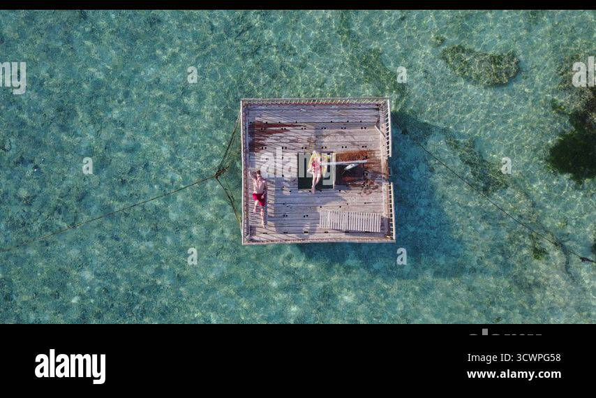 A water raft floating on the crystal clear water anchored at the beach ...