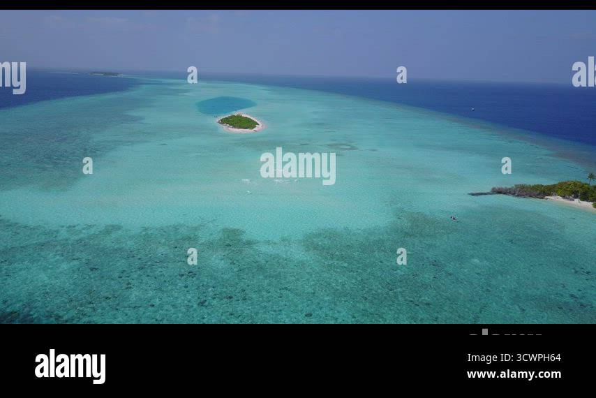 A small remote island rich in vegetation and trees in the middle of the ...