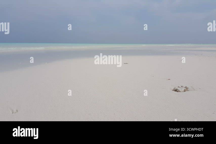 Sugary white flat sand and shallow water at the beach in Thailand Stock ...