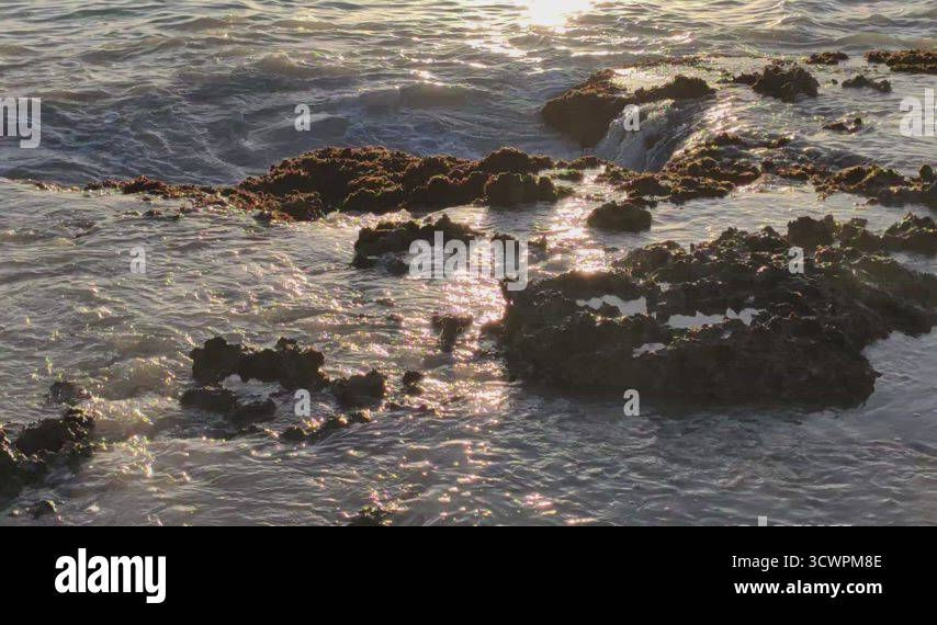 Shoreline water breaks on rocks Stock Videos & Footage - HD and 4K ...