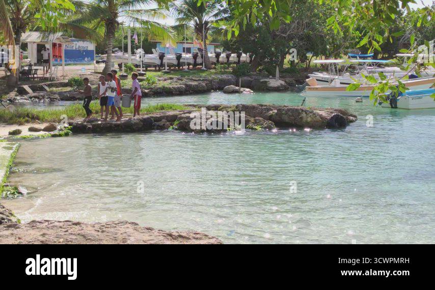 Poor Dominican children play in Bayahibe 3 Stock Video Footage - Alamy