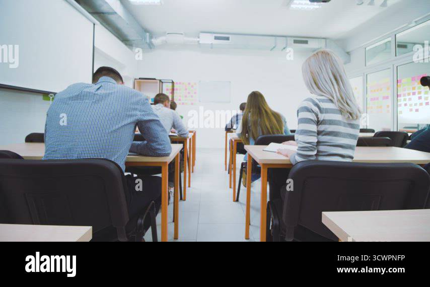 young students having conversation in classroom Stock Video Footage - Alamy