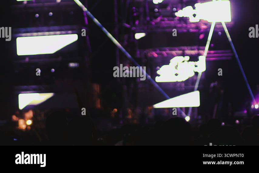 Flashing light beams from stage lights on a construction Stock Video ...