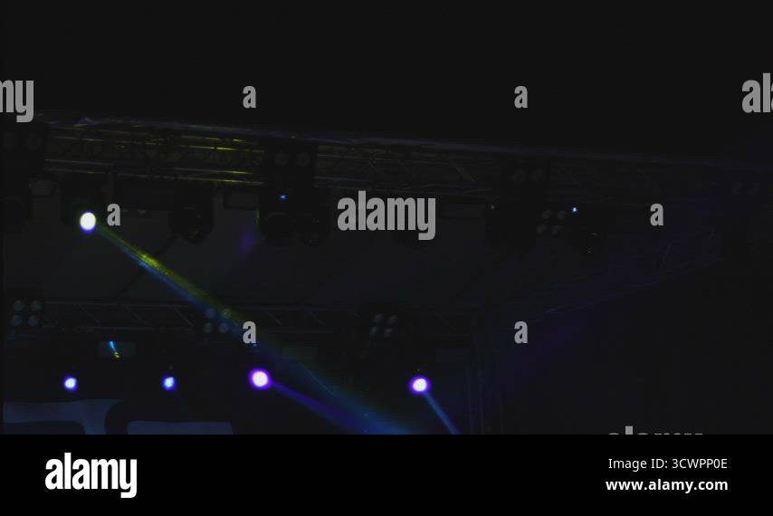 Flashing light beams from stage lights on a construction Stock Video ...