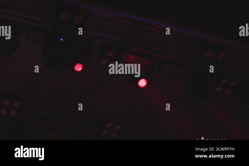 Flashing light beams from stage lights on a construction Stock Video ...