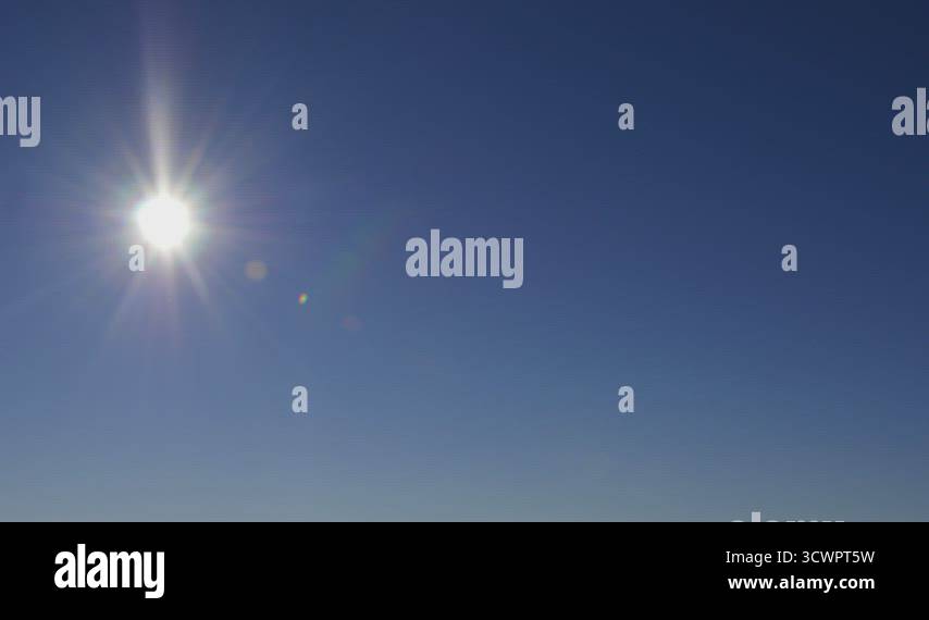 Sun moving across the clear blue sky, 4k timelapse background Stock ...