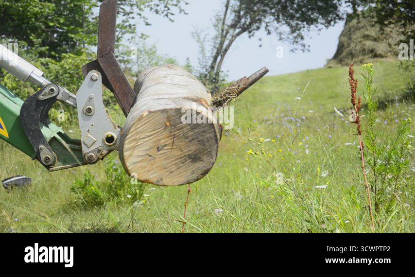 Agricultural wood timber loading machinery on a new tractor Stock Video ...