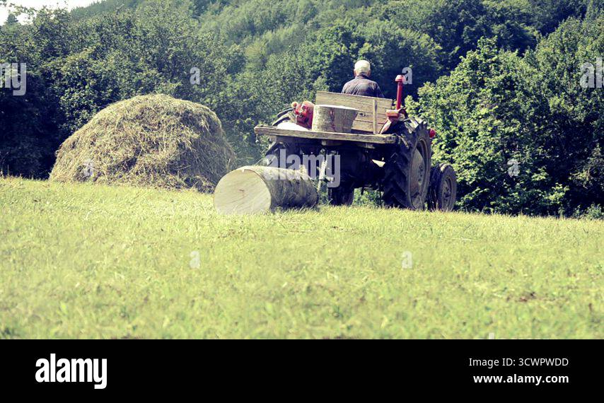 Construction Timber pulled by Tractor, vintage Stock Video Footage - Alamy