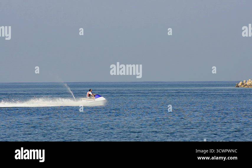 Tracking a sport man fast driving on a jet ski motor Stock Video ...