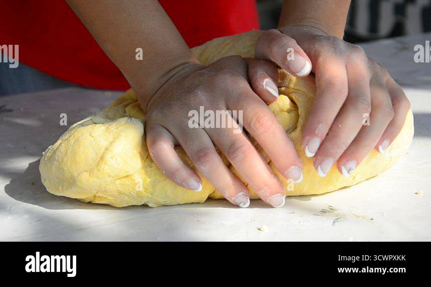 Preparing Traditional Italian Food, Female hands kneading dough on ...