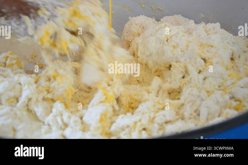 Old traditional manual dough mixing. Preparing Traditional Food - Stock ...