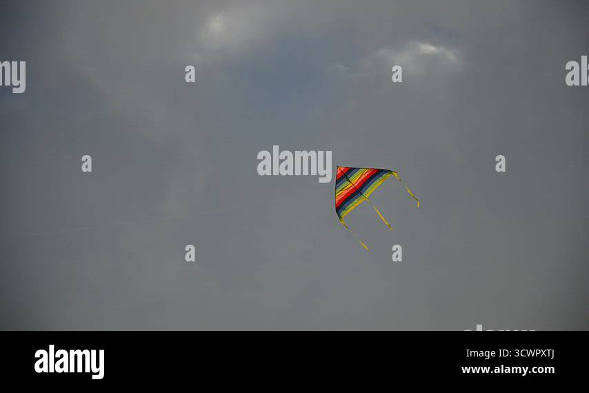 High Flying Kite. High flying kite sailing in a blue sky with soft ...