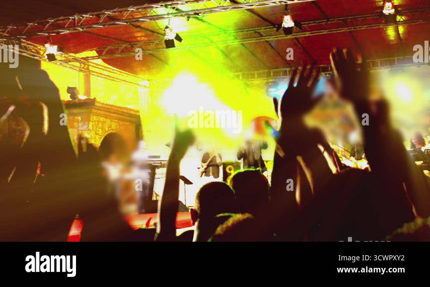 dancing crowd hands up at music concert. Hands silhouettes waving Stock ...