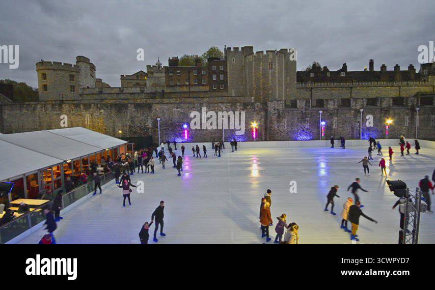 London - circa DEC 2013: Twilight ice skating scene on the ice rink at ...