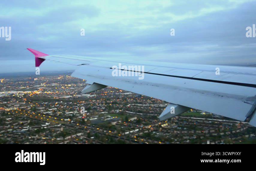 commercial plane is landing on London, Luthon airport and fly over ...