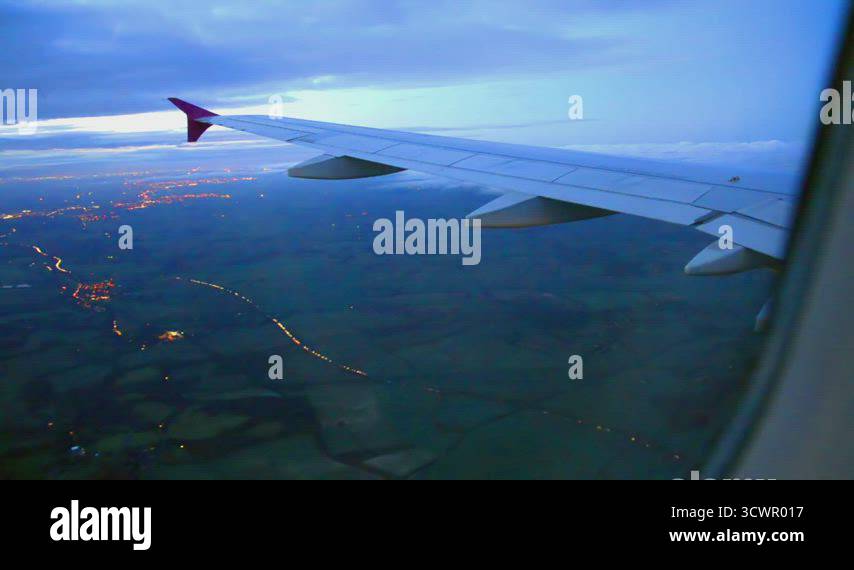 commercial plane is landing on London, Luthon airport and fly over ...