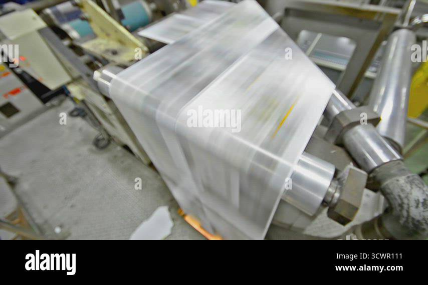 News print factory - Stock Video. Newspapers being carried to folding ...
