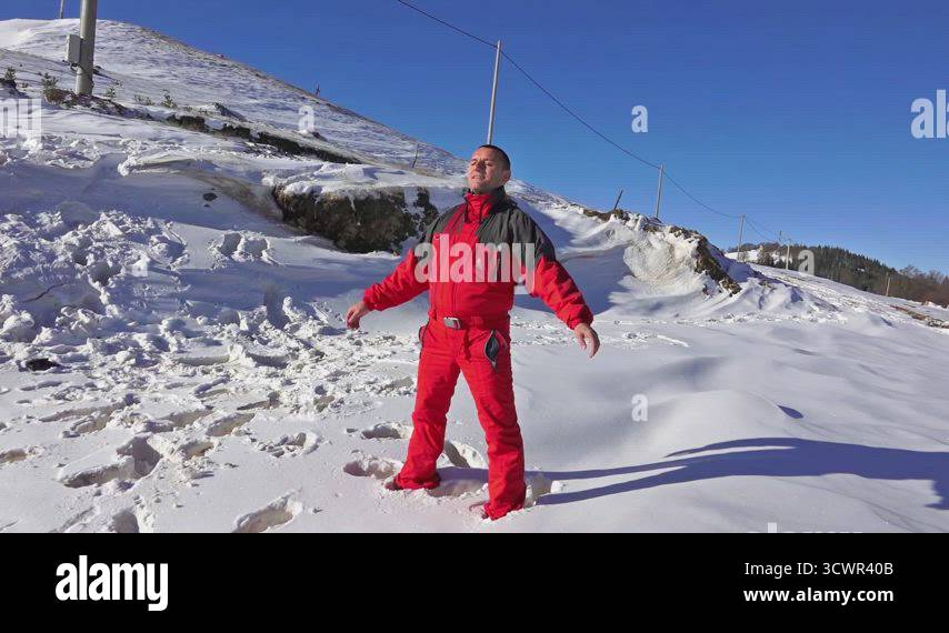SLOW MOTION: Young man making snow angels, steadycam stock video Stock ...