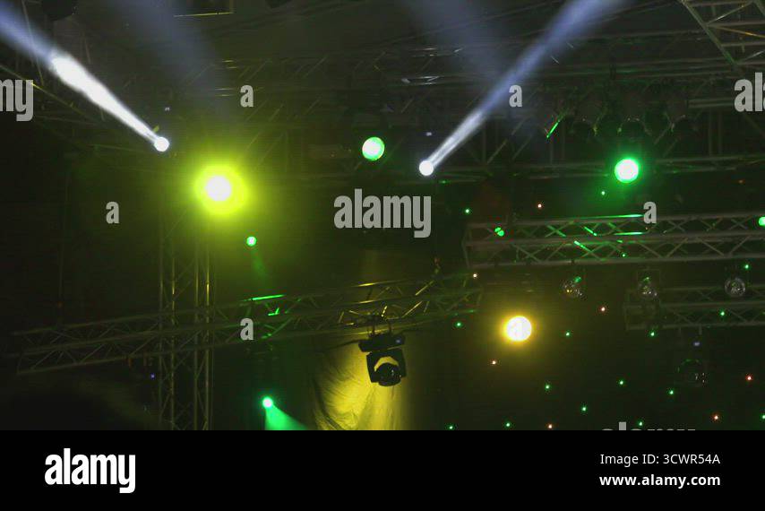 4k Stage lights on concert. Lighting equipment with multicolored beams ...