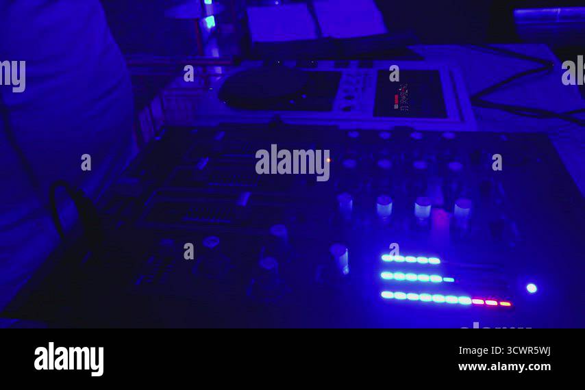 DJ on dj's deck, steadicam dark blur Stock Video Footage - Alamy