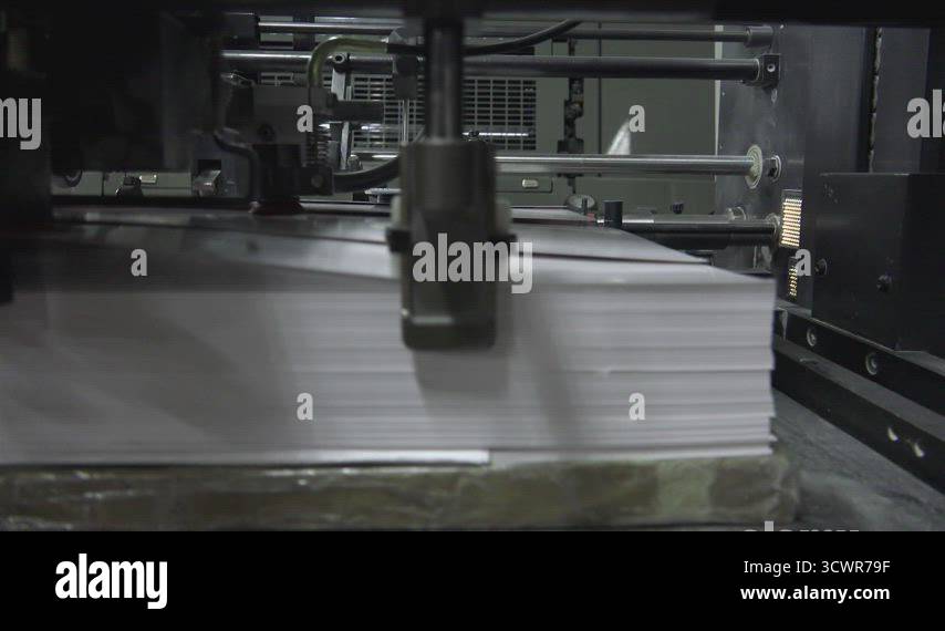 Print sheets are loaded in commercial offset printing press machine ...
