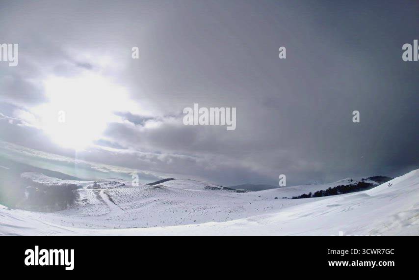 Moving winter postcard: Snowy hills panning timelapse. 4k uhd View from ...
