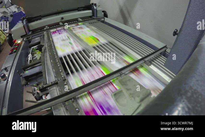 4k folding machine folds printed offset sheet as part of newspaper ...