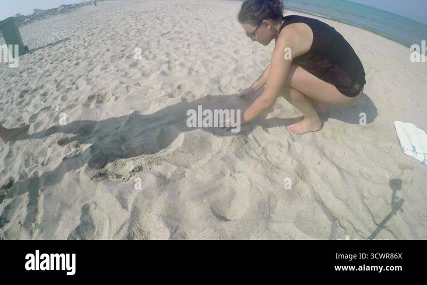 Summer timelapse of people digging girl in the beach sand Stock Video ...
