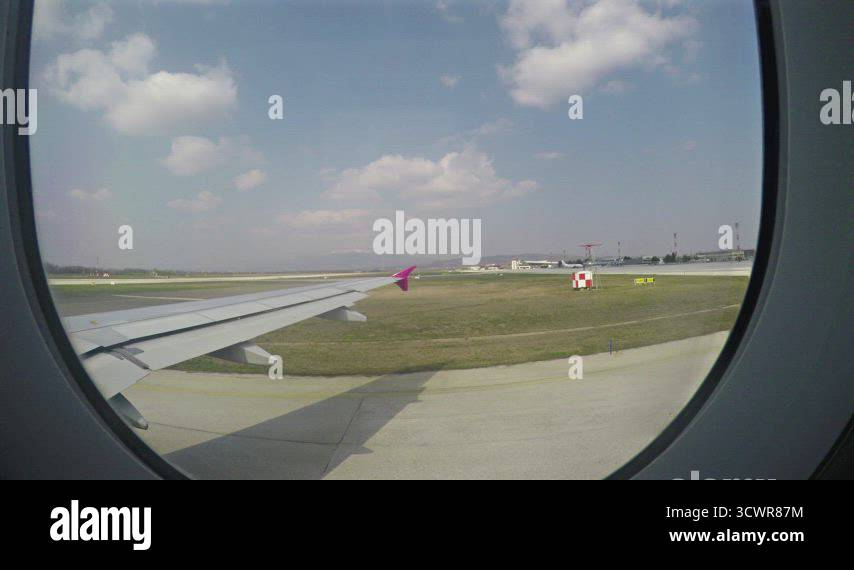 Plane takes runaway position before take off. Passenger pov from window ...