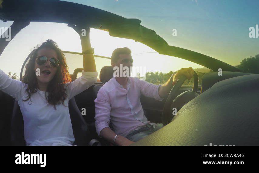 Timelapse Of Couple Driving Convertible Cabriolet Car With Sunset Sun