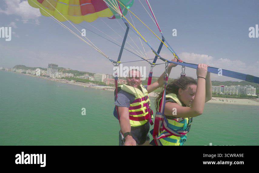 4k Tandem paragliding over sea Stock Video Footage - Alamy