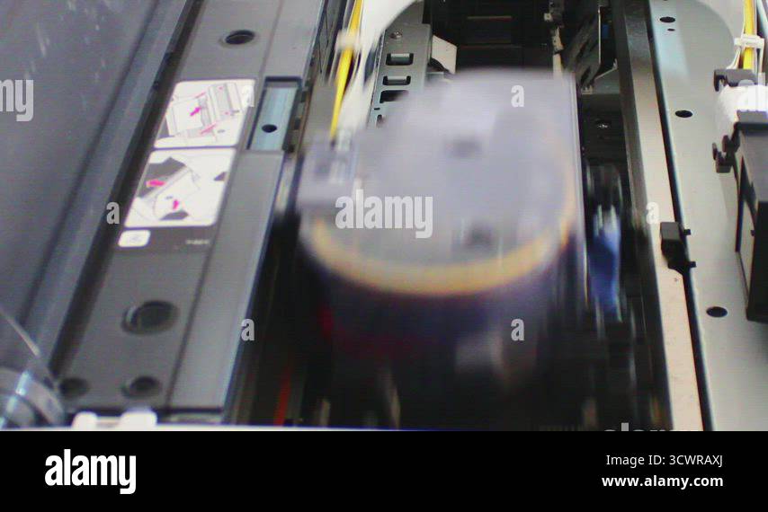 Computer Printer Head in Action, A close up of a computer printer head ...