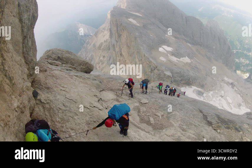 DOLOMITES, ITALY - CIRCA SEPTEMBER, 2015: Mountaineer pov to expedition ...