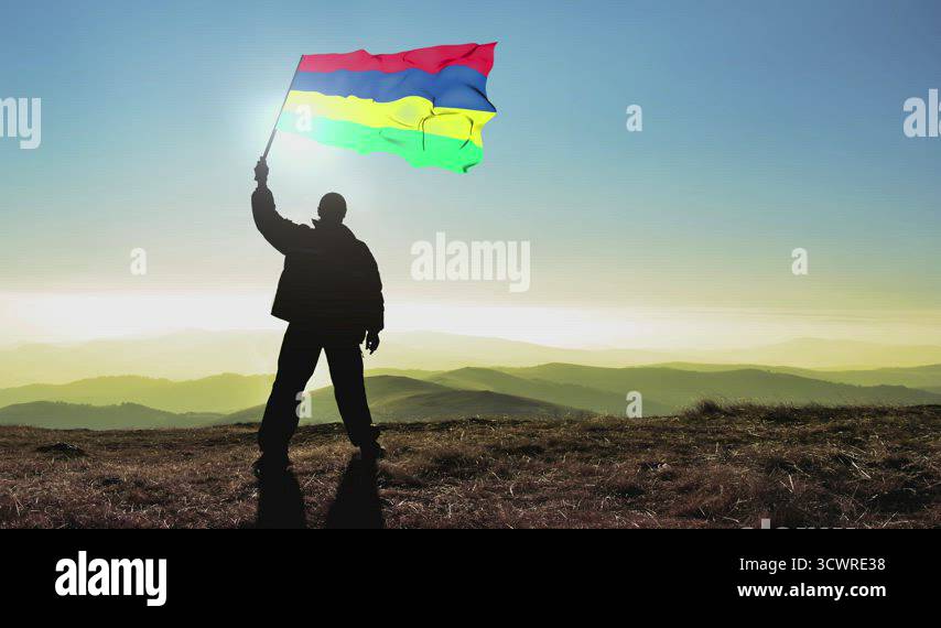 Successful silhouette man winner waving Mauritius flag on top of the ...