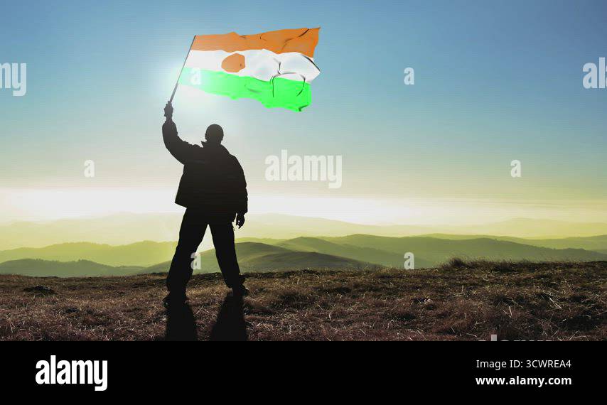 Successful silhouette man winner waving Niger flag on top of the ...