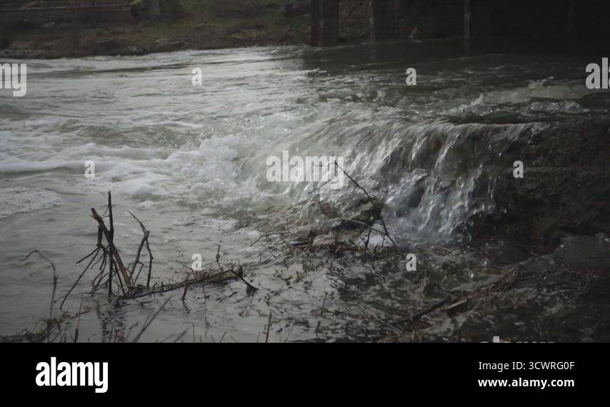 Quickly running water in the canal under the old bridge, Tiligul ...