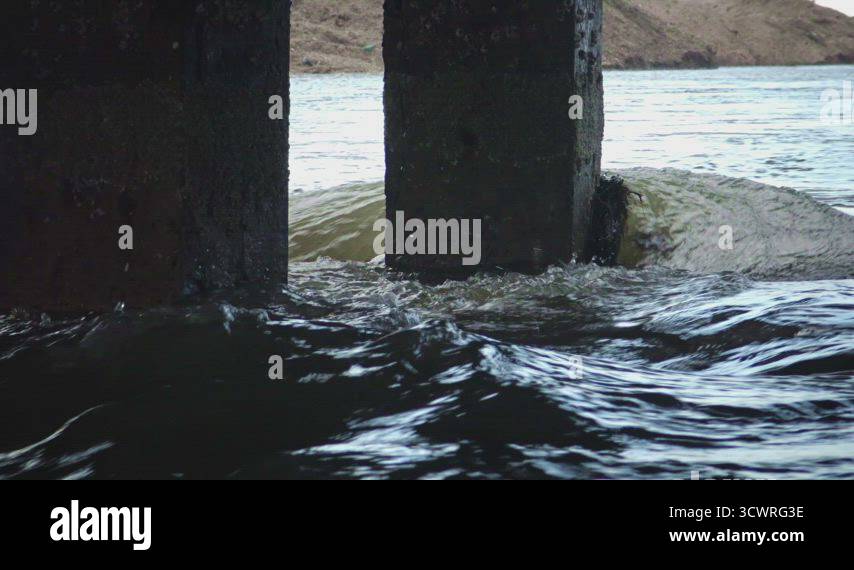 Quickly running water in the canal under the old bridge, Tiligul ...