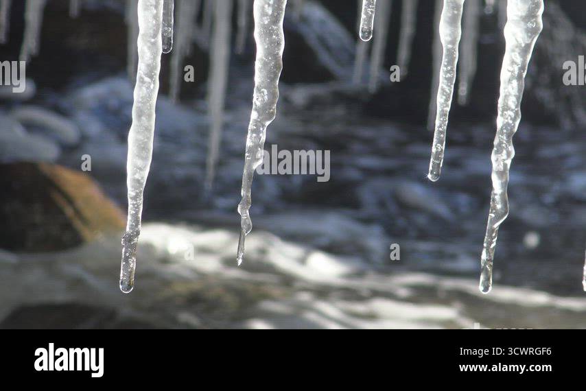 Frozen water, icicles against the background of moving seawater Stock ...